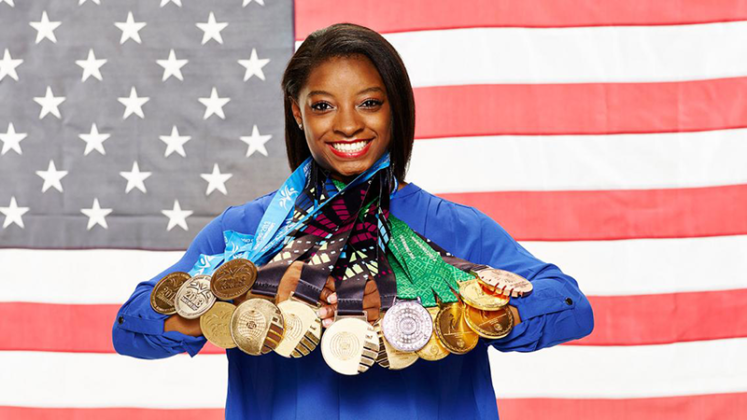 Gymnast Simone Biles vaulted over obstacles with God